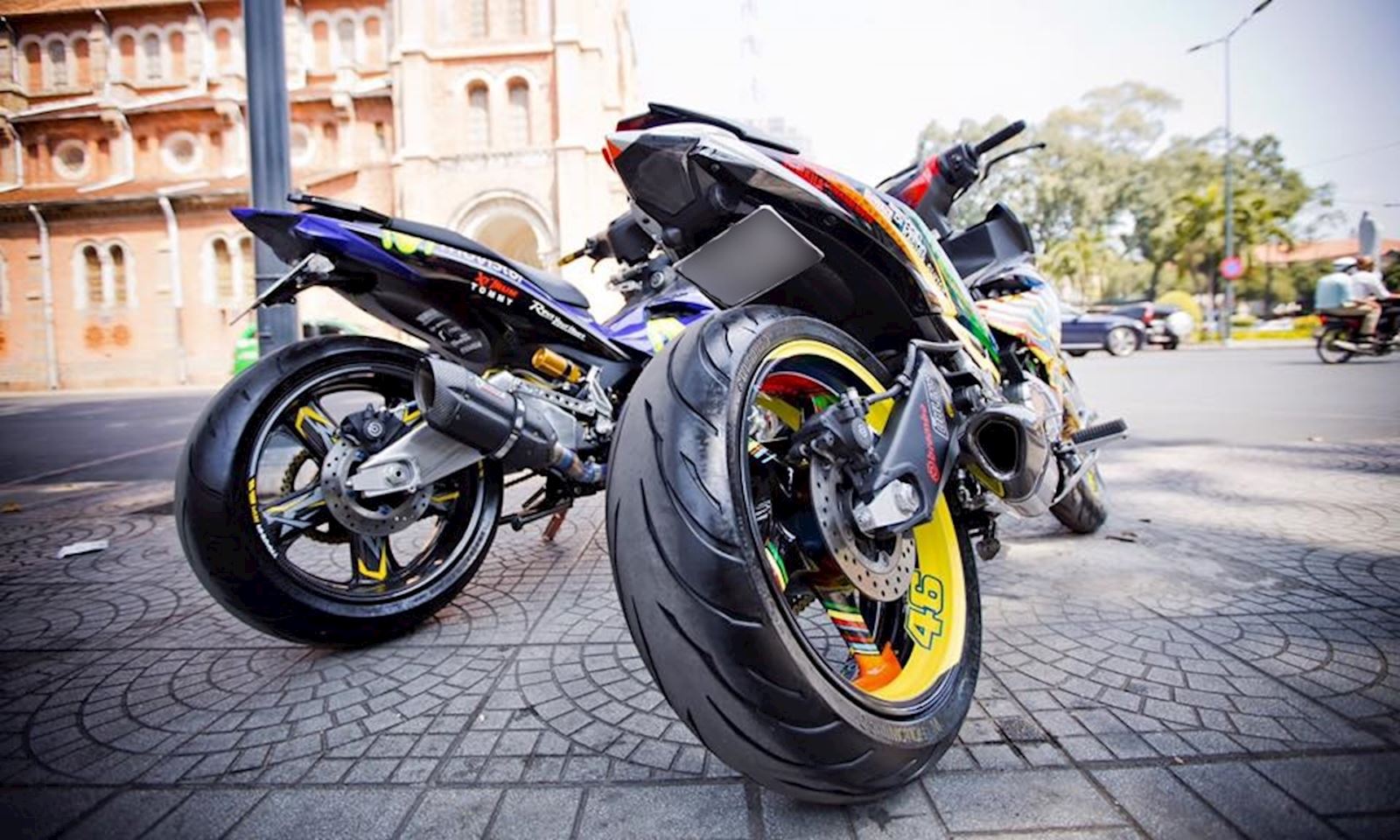 Why are the two wheels on motorcycles different in size?